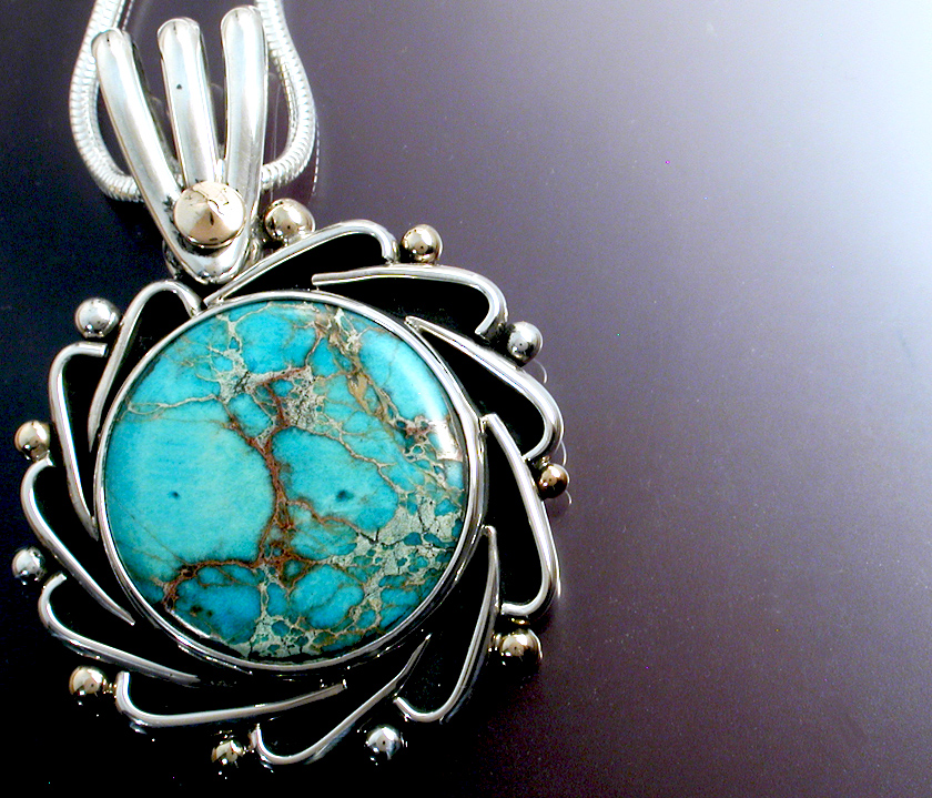 Silver & Gold Spinning Pendant - Eventeny