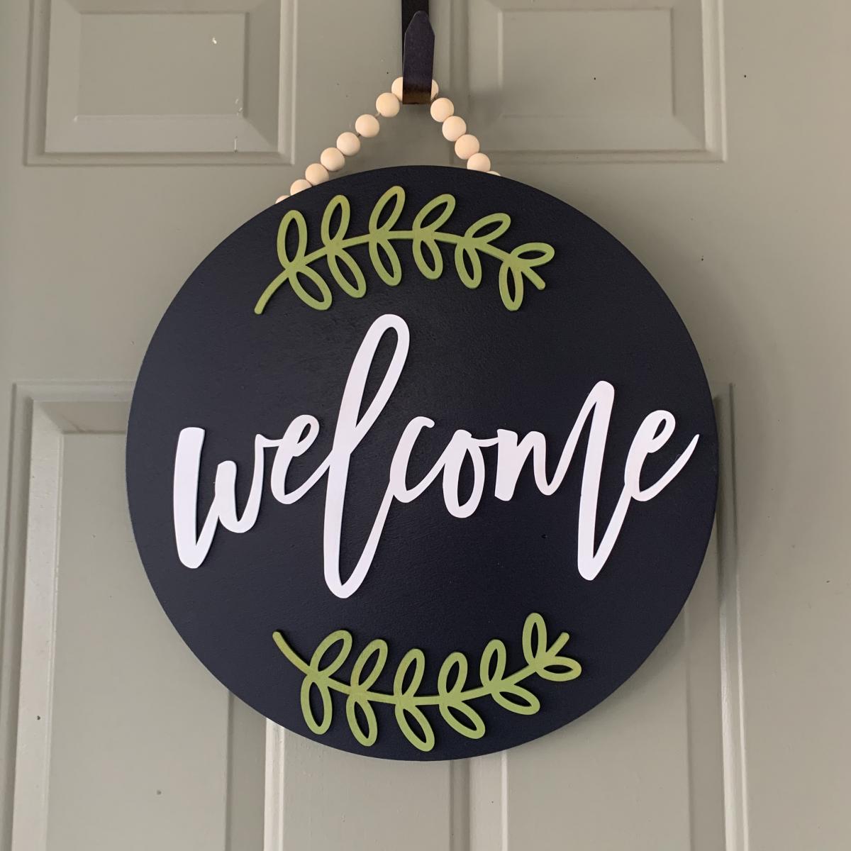 Welcome round Door sign With green laurel - Eventeny